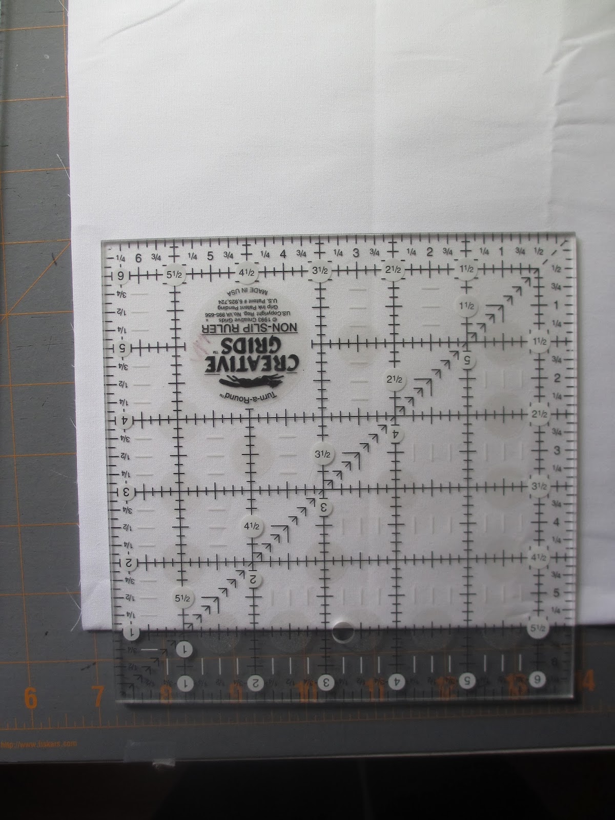 Hold the small square ruler firmly in place and now align the large ...