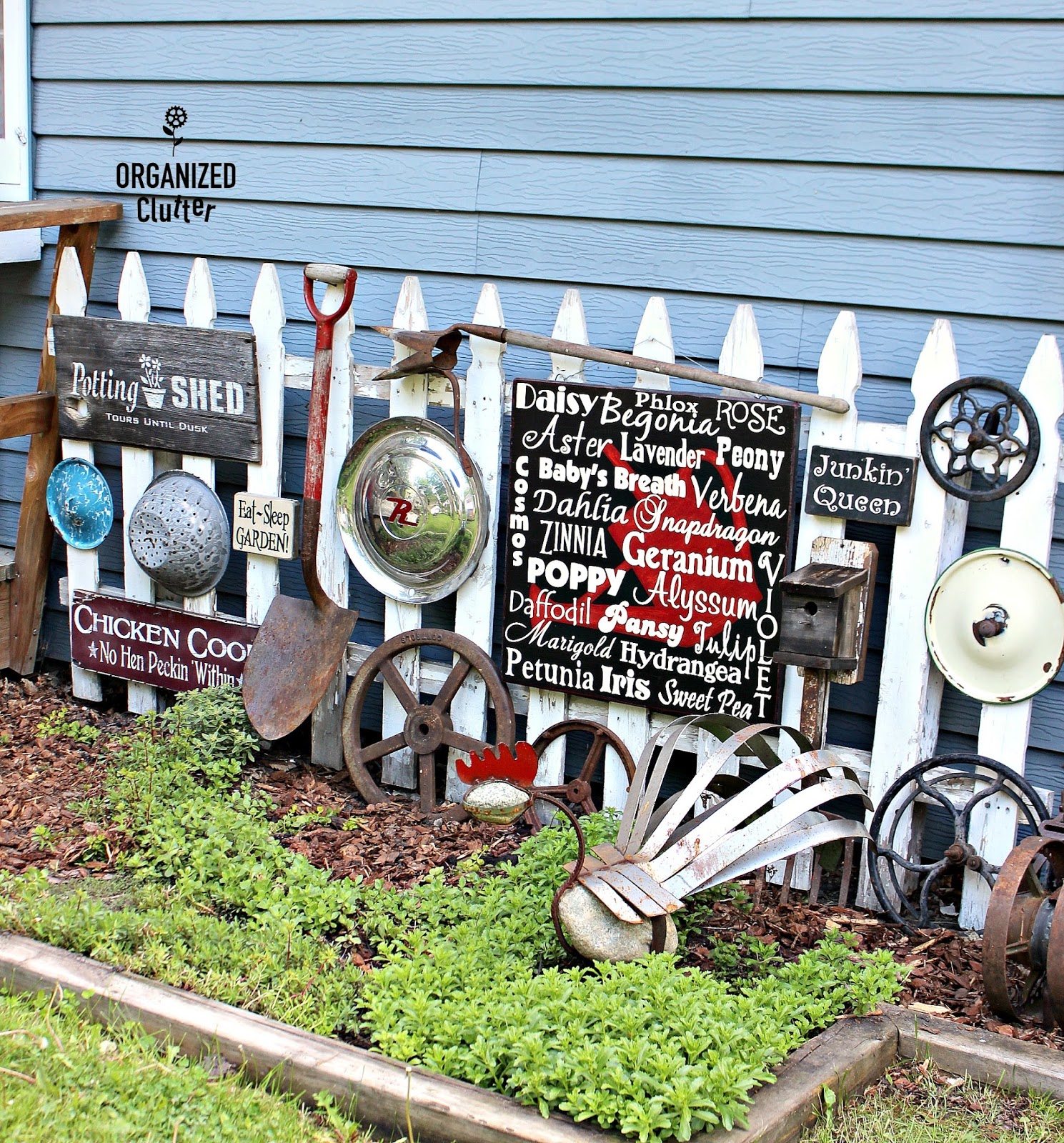 A Junk Garden "Gallery" Fence - Organized Clutter