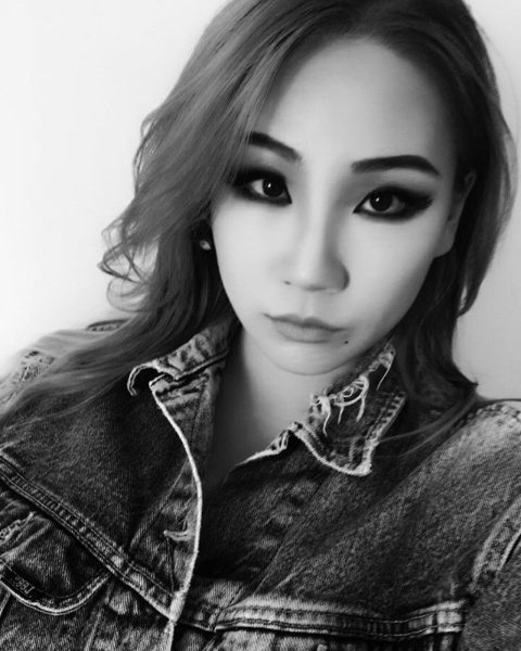 CL makes light of her fall in her green coat