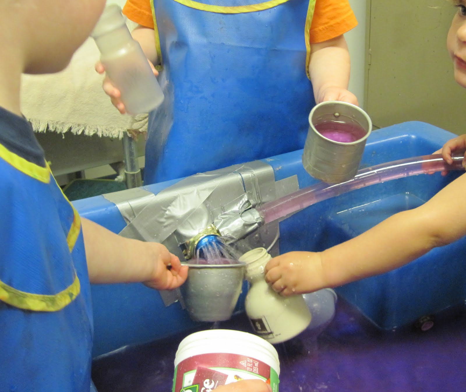 SAND AND WATER TABLES: Funnels and Clear Plastic Tubing - Experimenting