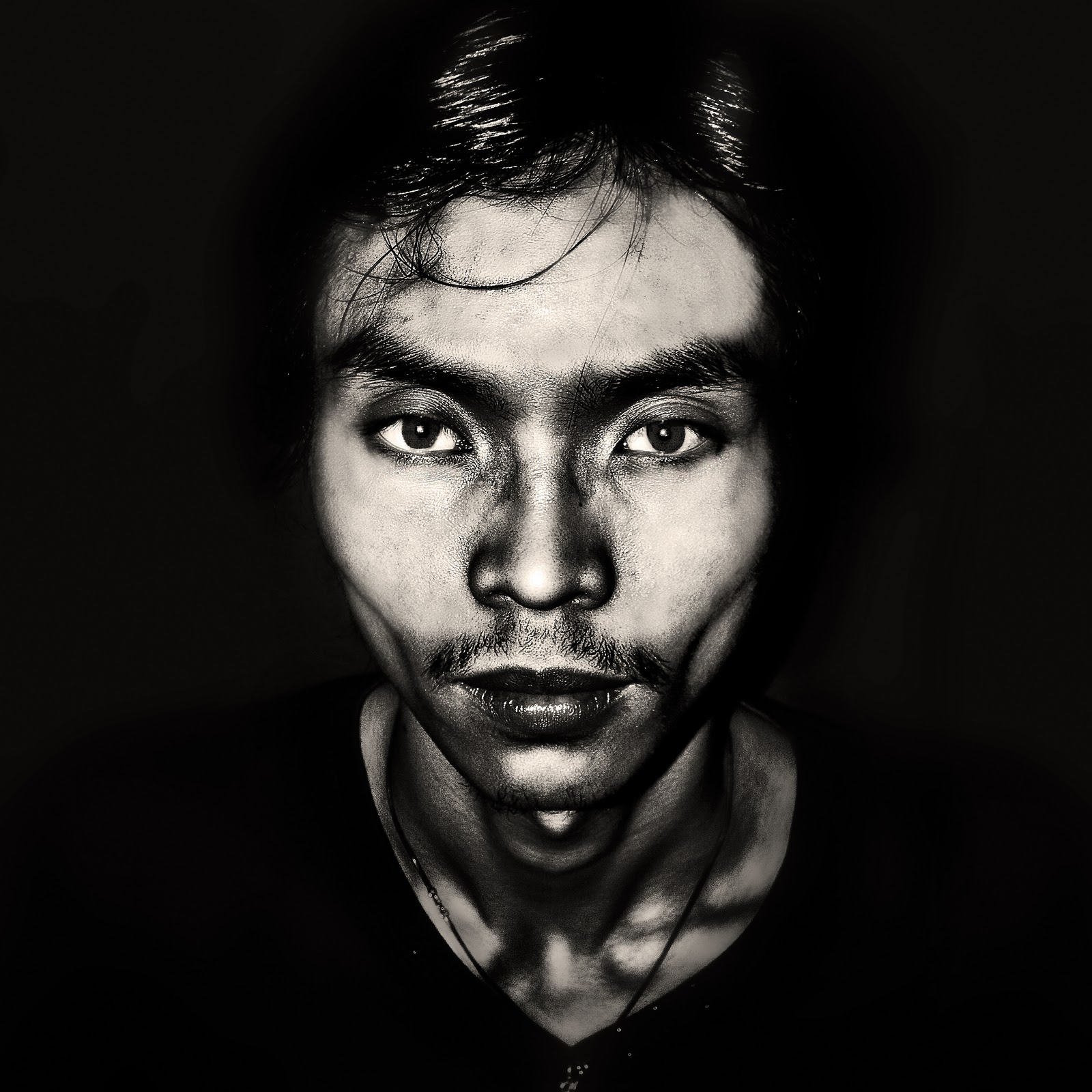 Lily Estelle: High contrast & clarity man's portrait in square format