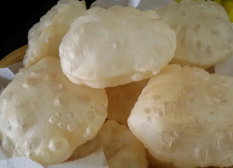 Luchi or Bengali Style Poori served with Aloo Chorchori or Potato Curry ...