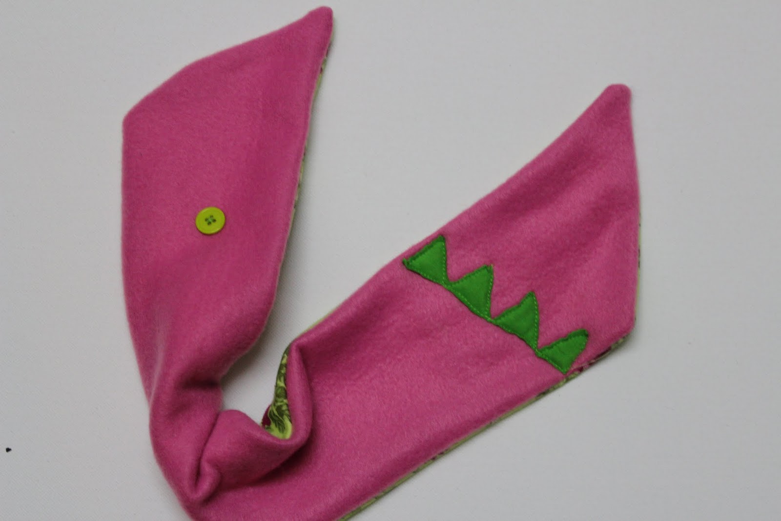 Sew the button on one side and button hole on the other. Make sure you ...