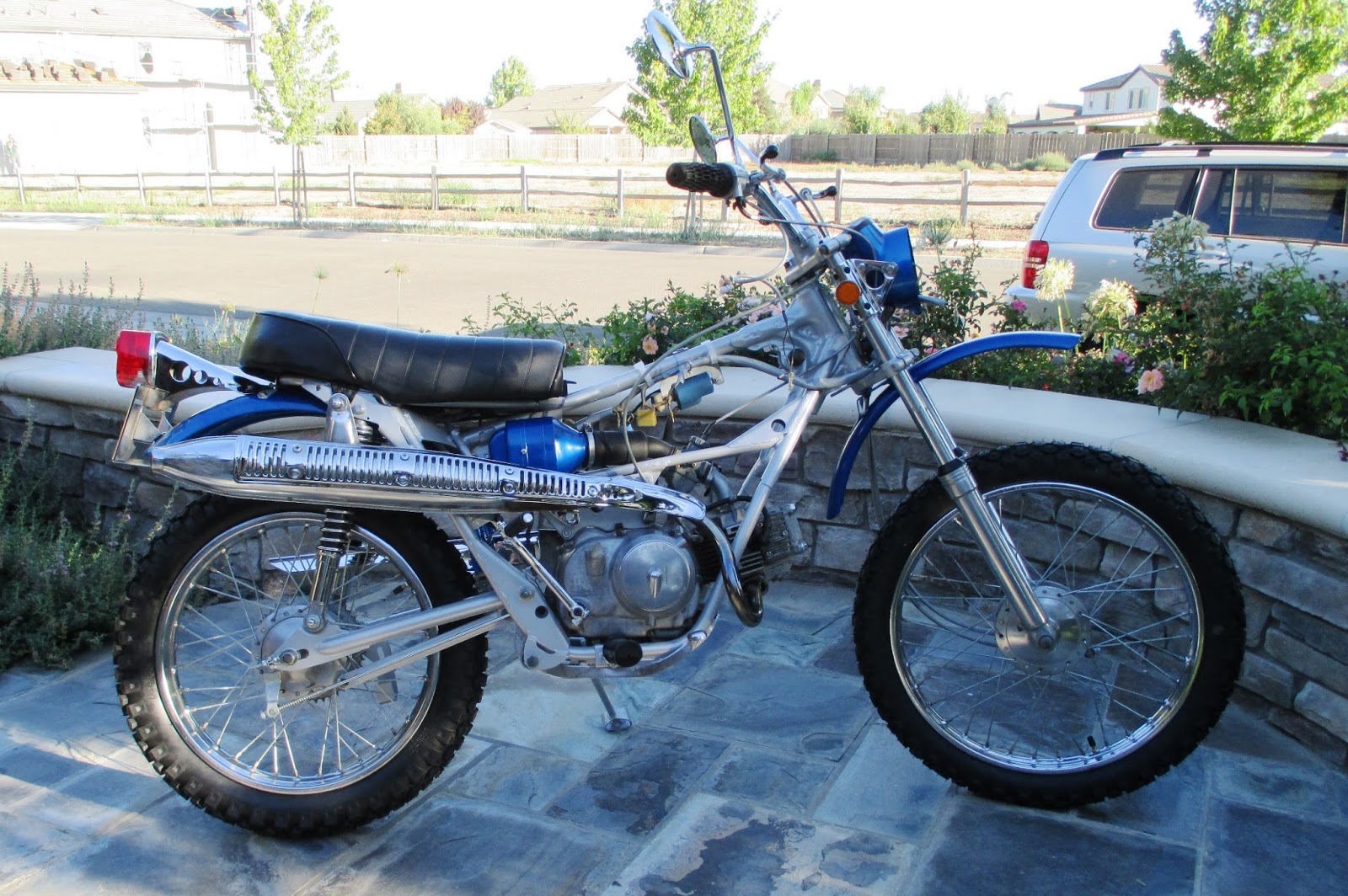 1969 Honda SL90: Front Wheel and Seat Logo