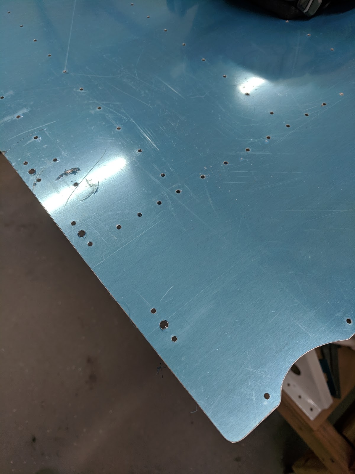 Damazio family's RV-10 project: Mid-fuselage bottom skins ready to rivet