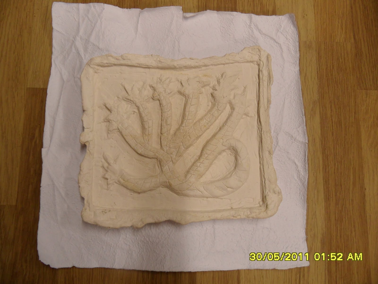 GREEK MYTHOLOGY: CARVING OF DESIGN ON TABLETS