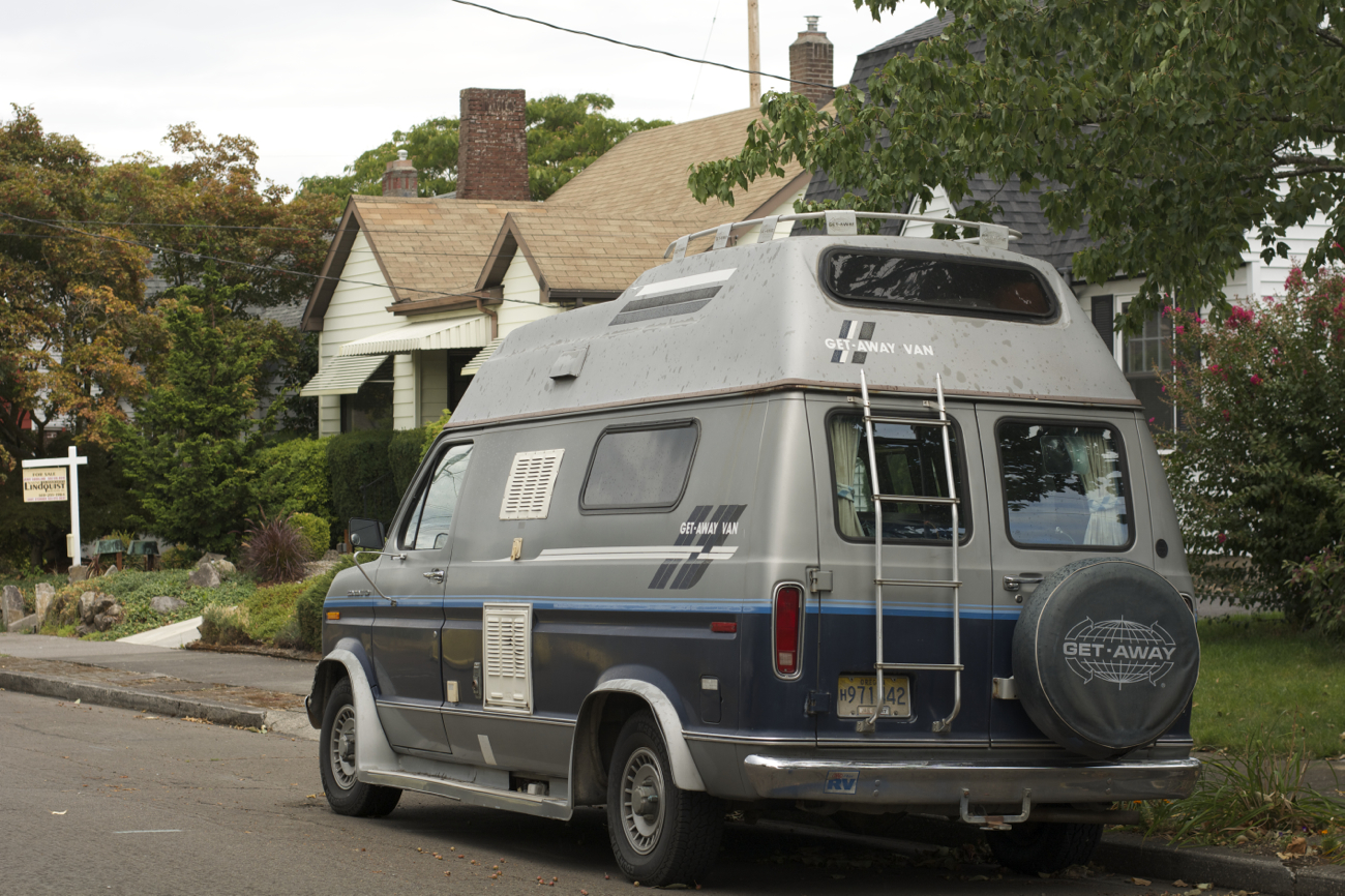 OLD PARKED CARS.: 1986 Ford Getaway Van.