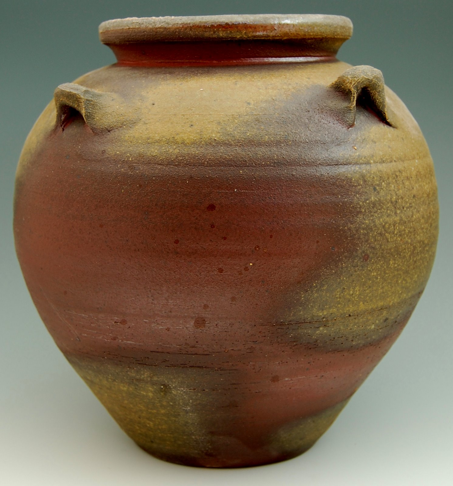 wood fired pottery: Two Tsubo and a Chawan made from a mid fire red clay.