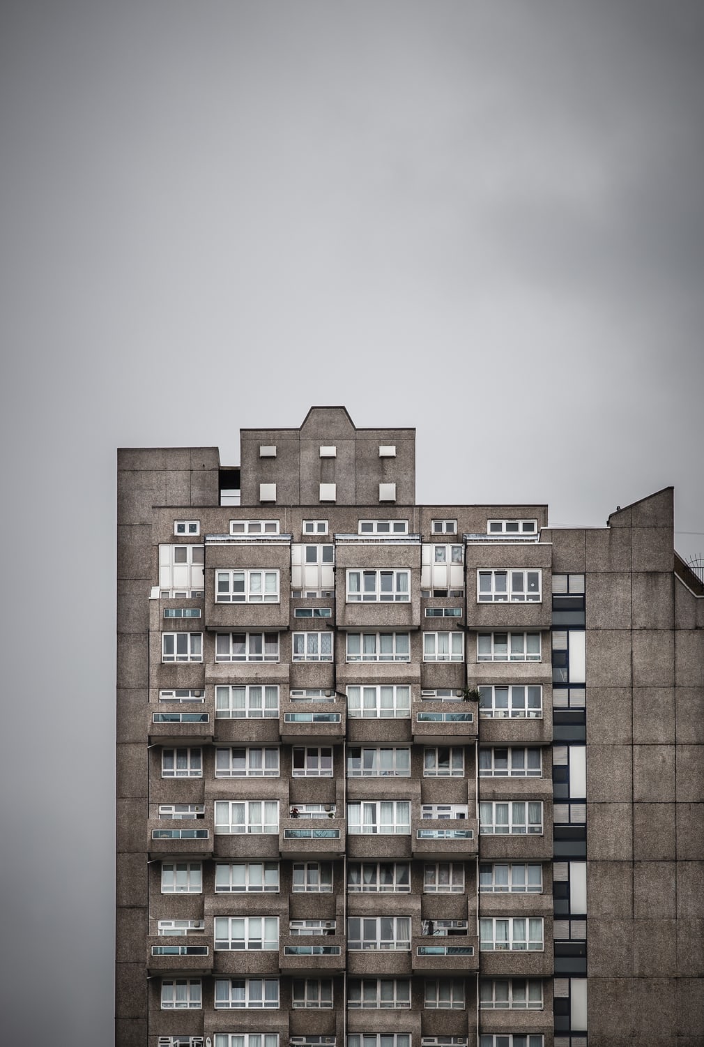 Grey concrete flats, generic office blocks, a grimly rising skyscraper
