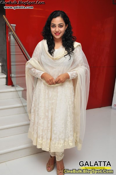 Nithya Menon Gorgeous in White Chudi Photo Gallery At Audio Launch of ...