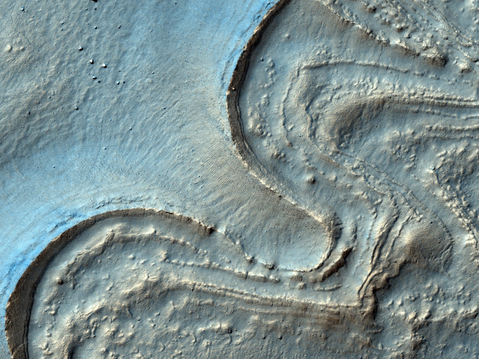 Areology: Gullies and Curved Ridges at the Base of Crater Walls
