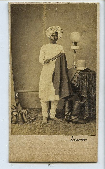 Indian Servant Brushing Employer's Jacket - c1870's - Old Indian Photos
