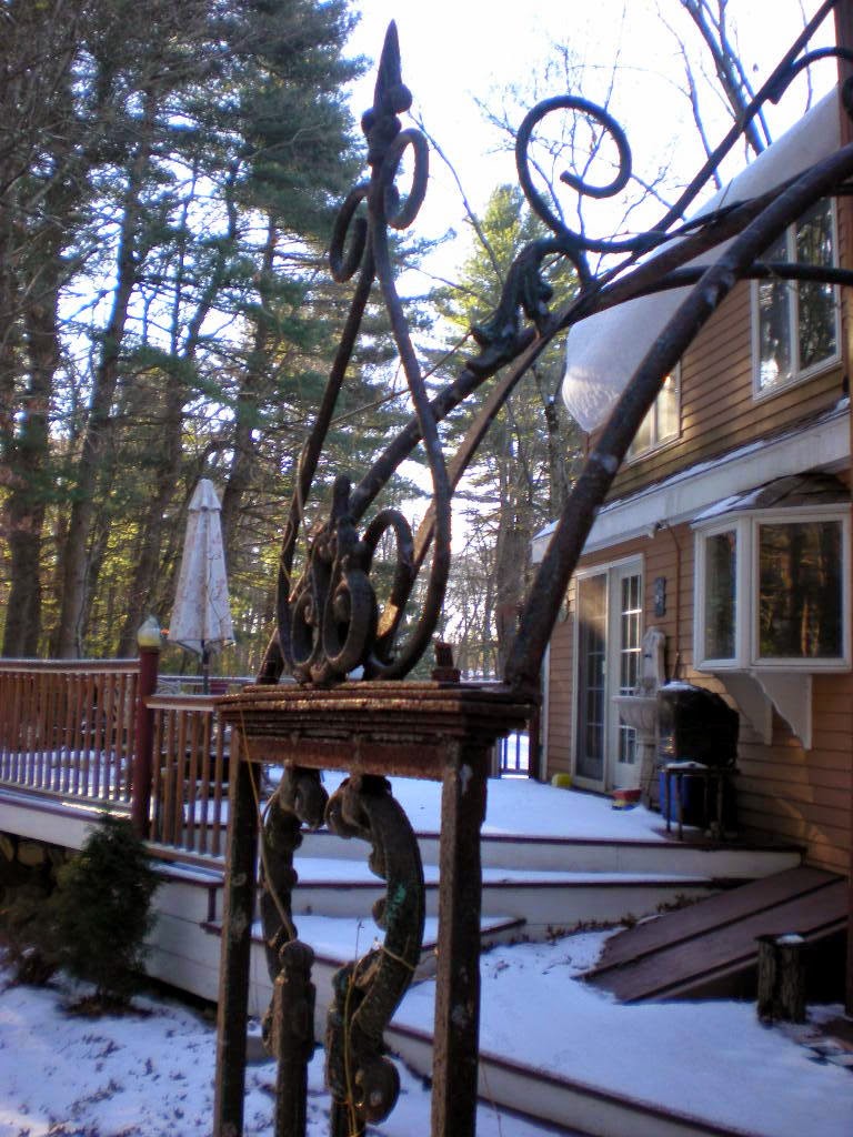 East Coast Styler : Antique Wrought Iron Arbor with a DIY Pallet Fence