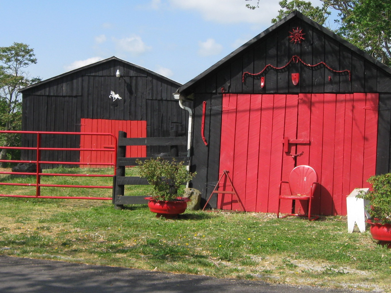 FOLKWAYS NOTEBOOK: RED AND BLACK OUTBUILDINGS