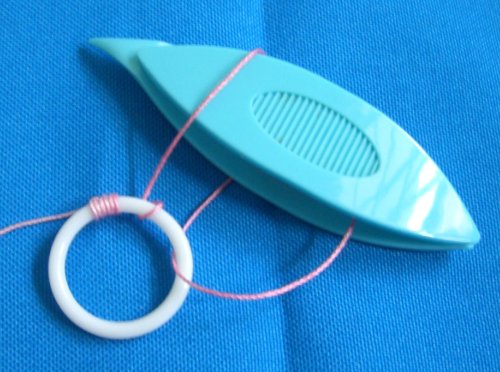 Wrapping a plastic ring with double-stitches