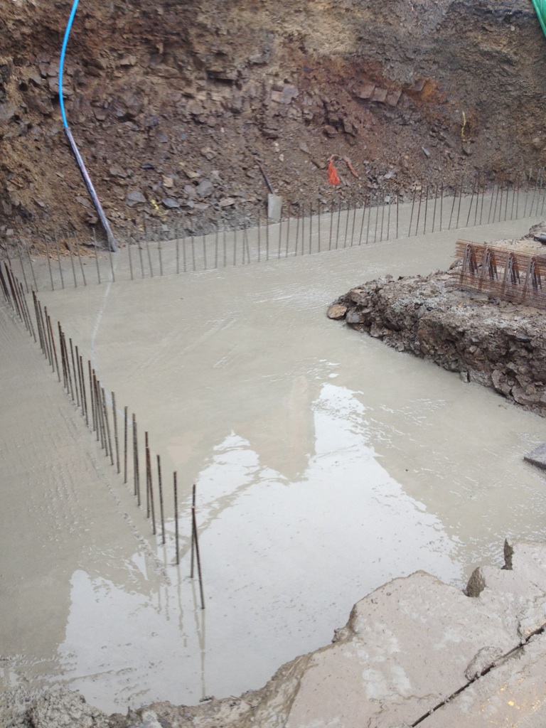 Amroth Project: CONCRETE POURED TO THE RETAINING WALL BASE.