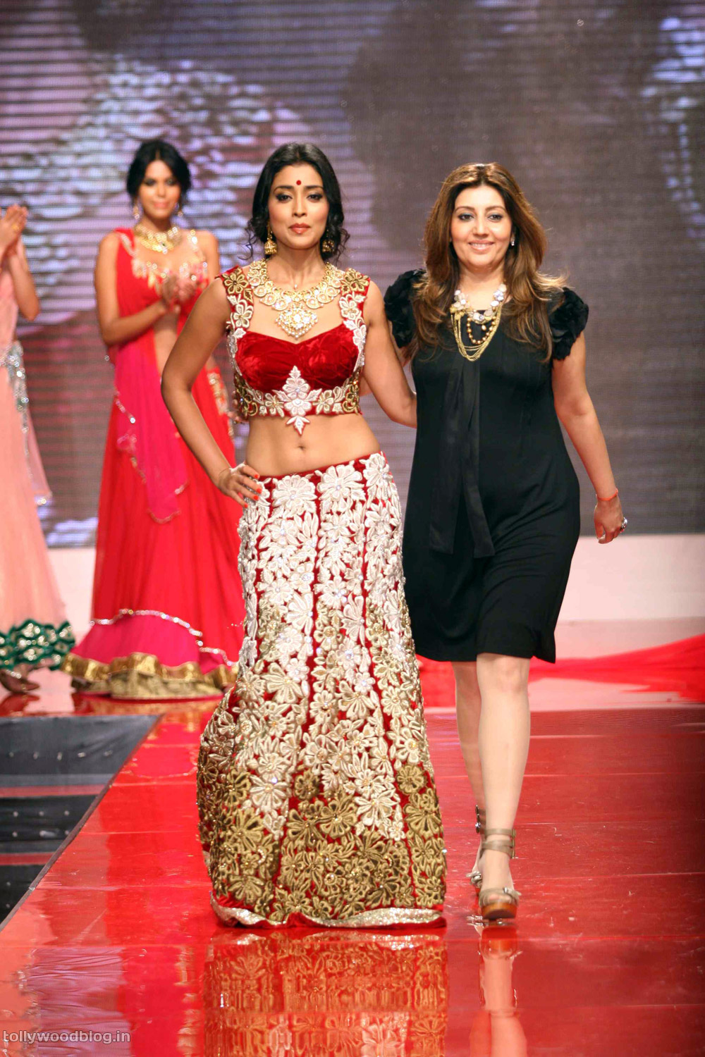 Shriya Saran Hot Ramp walk in Red Tradition Dress