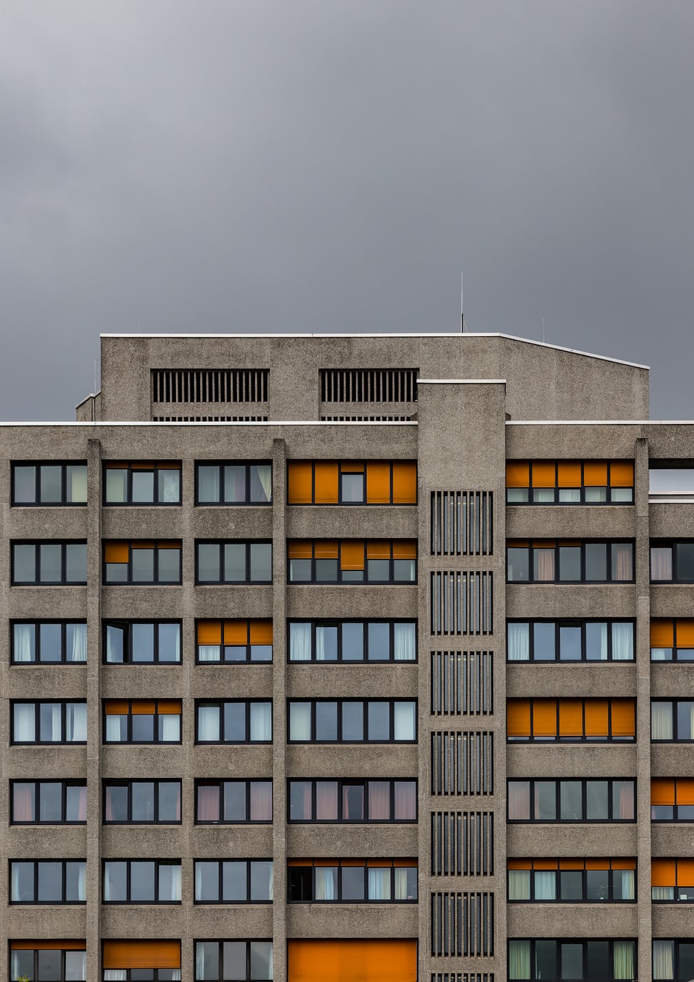 Grey concrete flats, generic office blocks, a grimly rising skyscraper