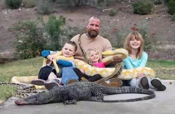 TF? Father let's his kids play with huge 19ft pet python (photos)