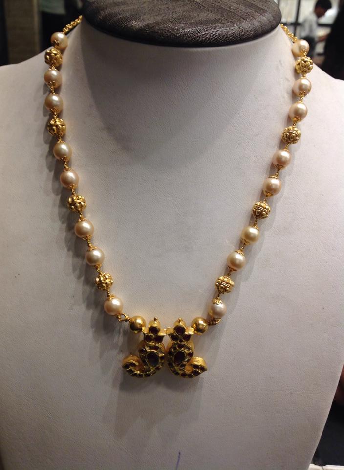 Jewellery Designs : #@ Pearl Chain with Puligoru locket