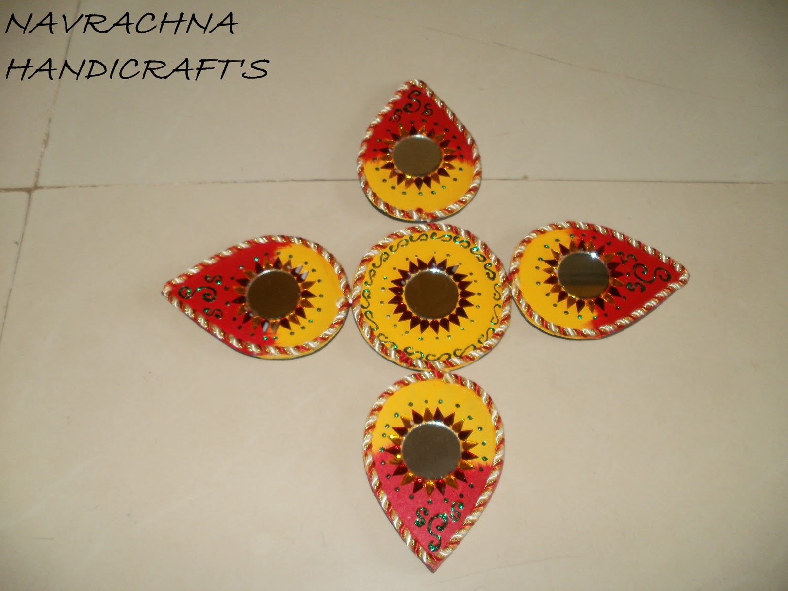 NAVRACHNA HANDICRAFT'S: small 5 piece rangoli-leaf shape