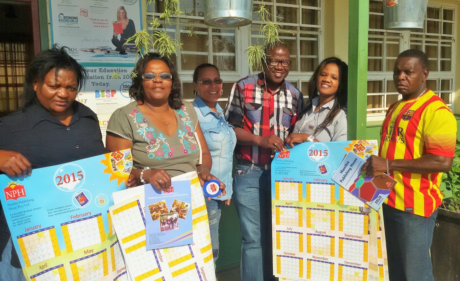 John and Karundu Primary School staff with NPH Calendars for 2015