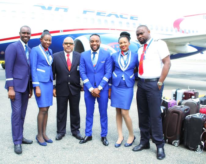 Kcee serves as cabin crew member for Air Peace flights (photos)