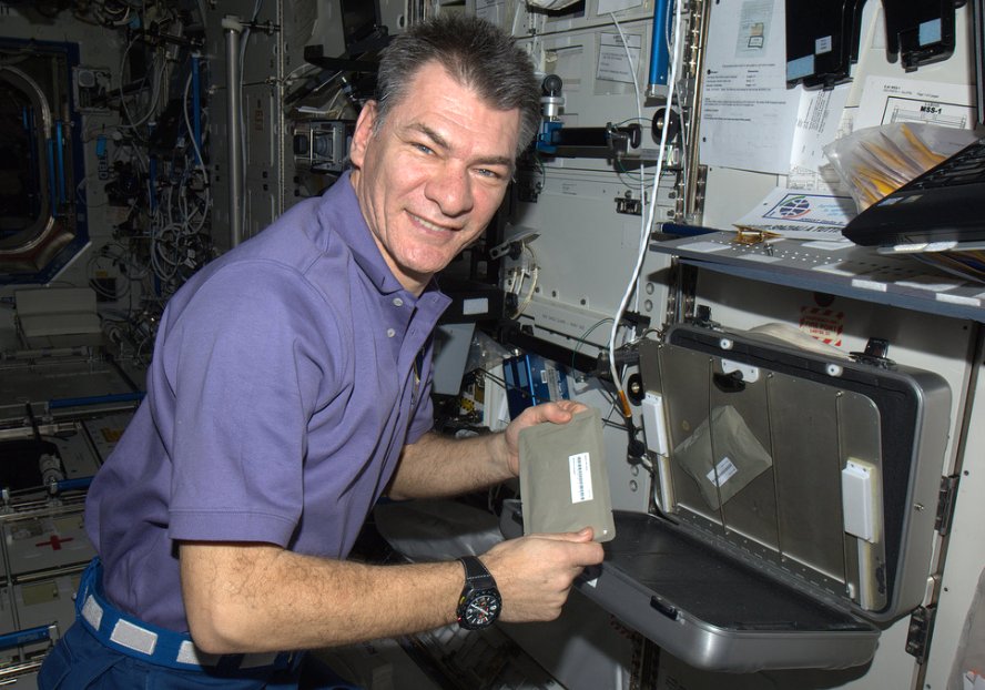 Suburban spaceman: ESA Astronaut Paolo Nespoli at the ISS food warmer!