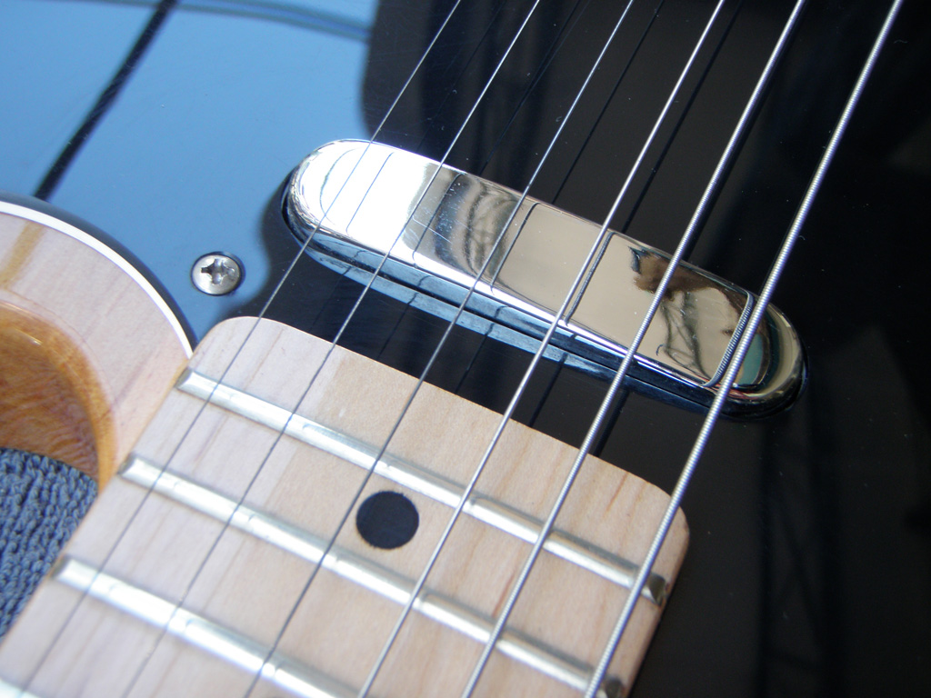 Adjusting the neck pickup height on a Fender Telecaster style guitar ...