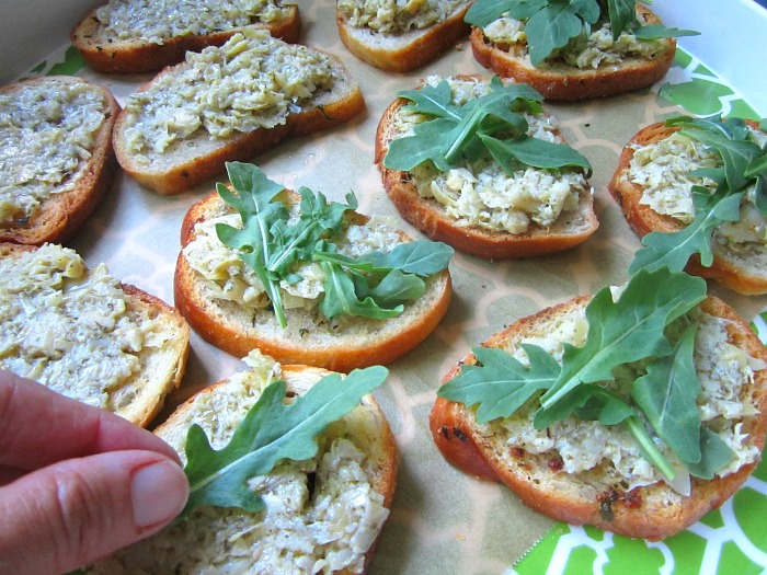Filet of Beef Crostini w/ Artichoke Pesto & Parmesan Curls