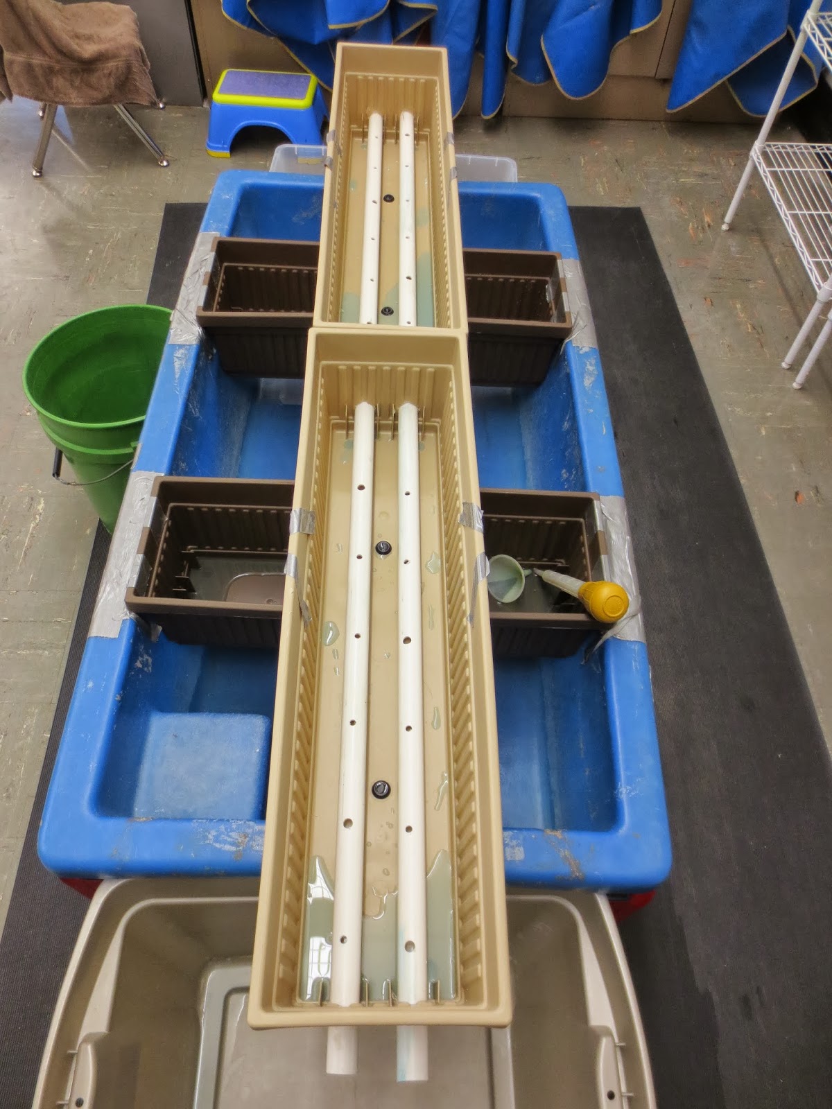 SAND AND WATER TABLES: PIPES EMBEDDED IN PLANTER TRAYS