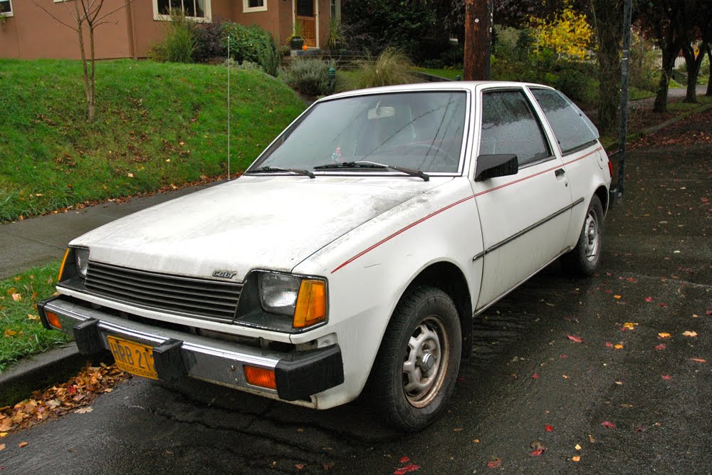 OLD PARKED CARS.: 1983 Plymouth Colt.