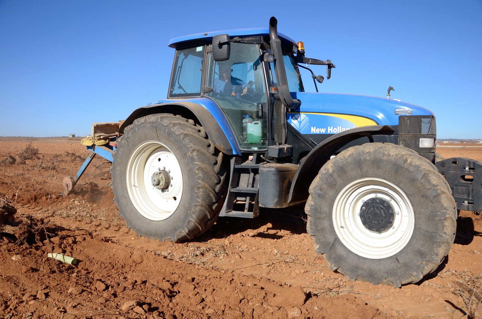 A new vineyard: taking out vines with the New Holland TM190