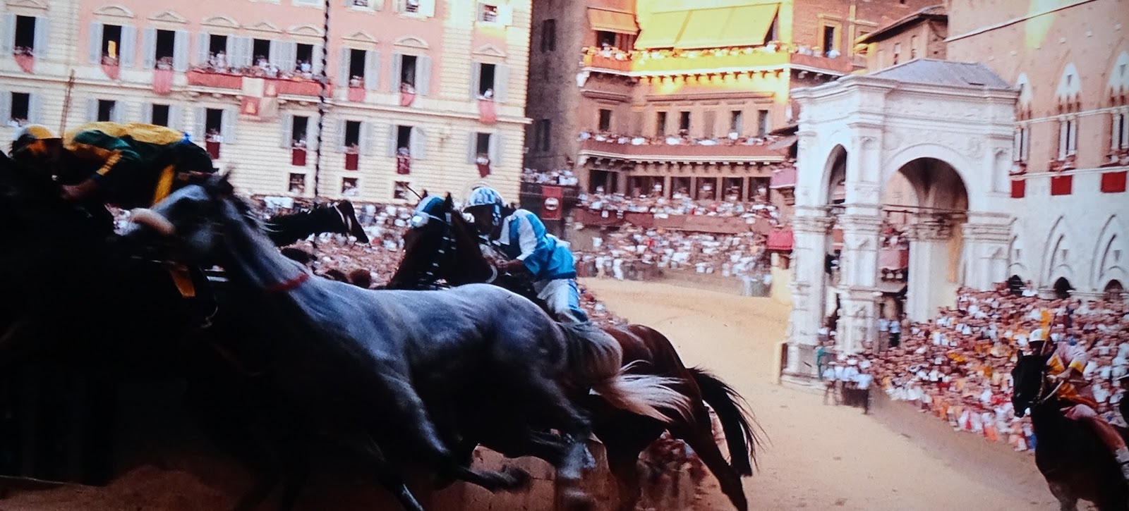007 TRAVELERS: 007 Filming location: Palio di Siena horse race square ...