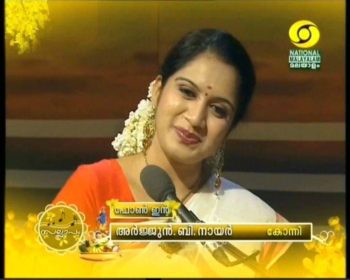 playback singer akhila anand in set saree cute images