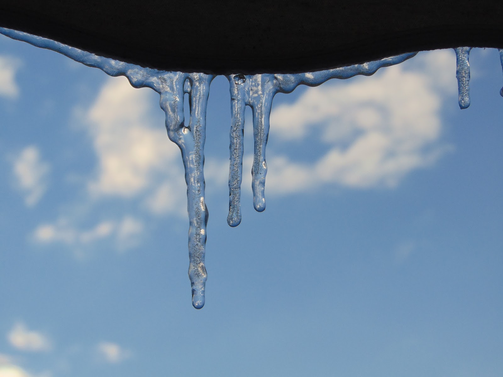 Icicles, stalactites, stalagmites, ice, sky
