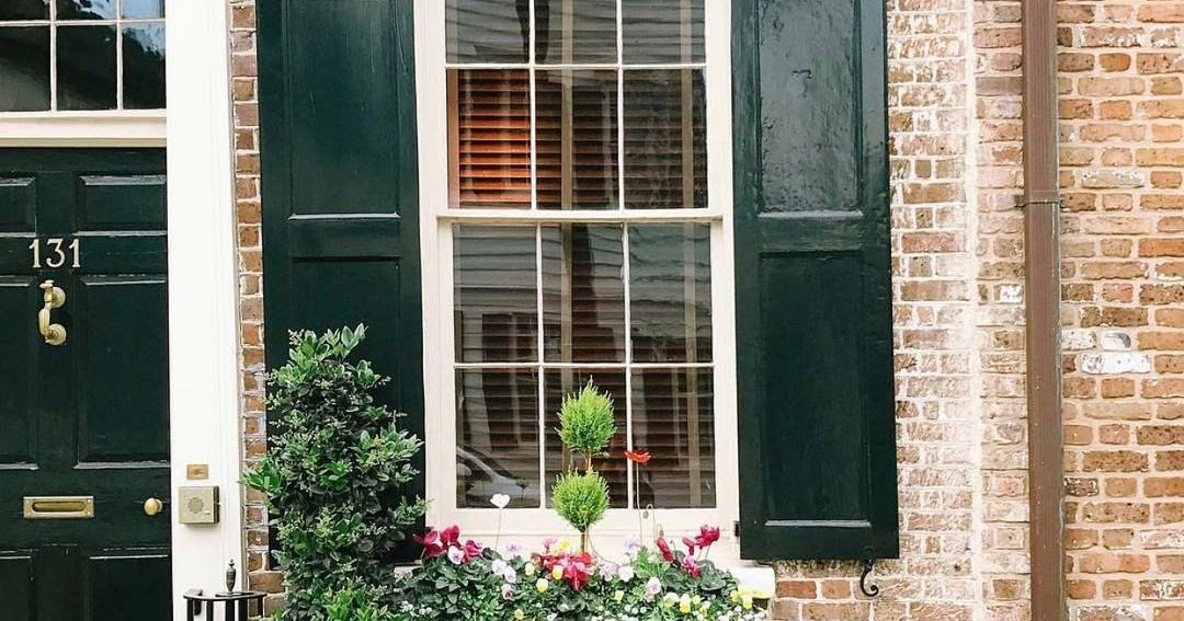 Content in a Cottage: Dark Green Shutters and Door