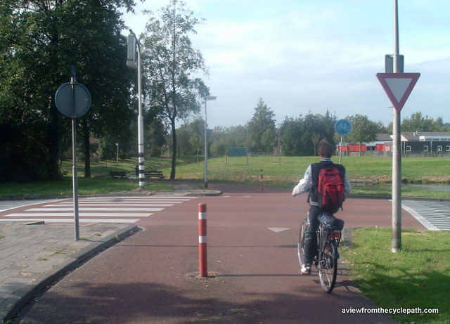 A view from the cycle path: Bollards on cycle-paths provide both an ...