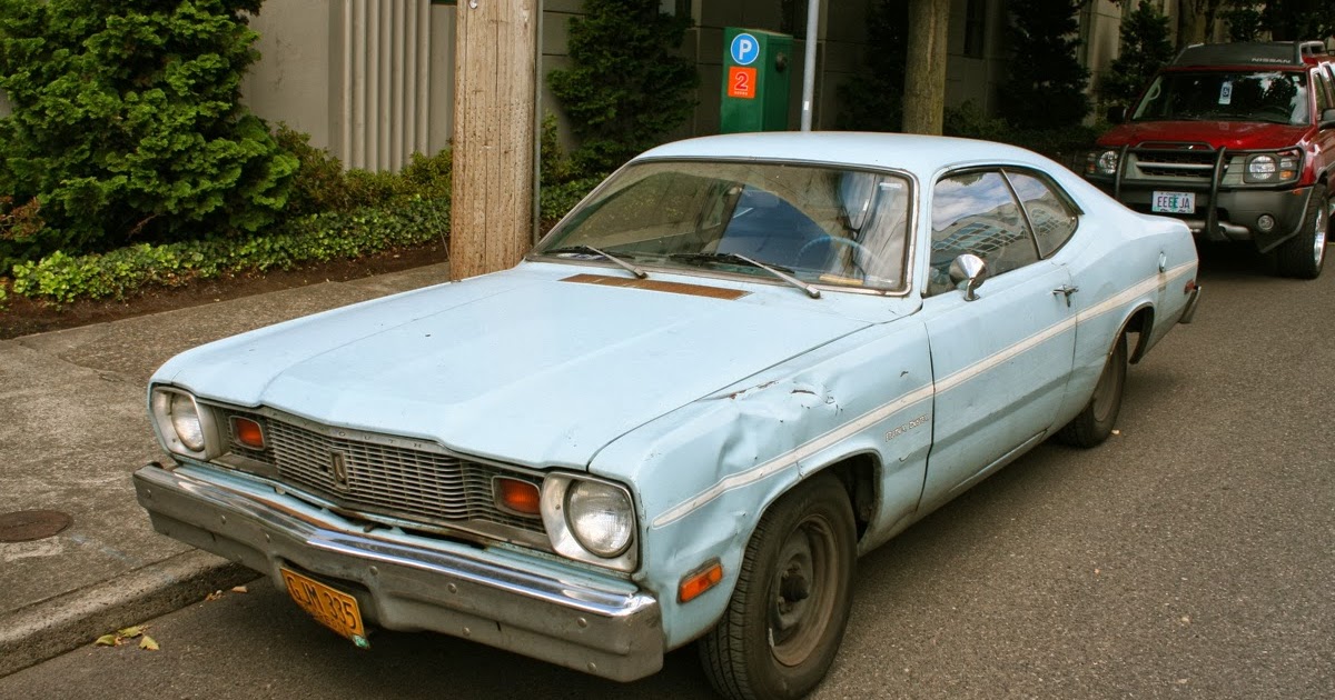 OLD PARKED CARS.: 1975 Plymouth Feather Duster.