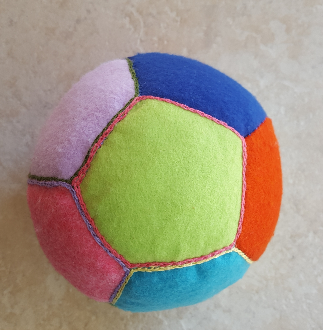 Quiltingorchardist: Stitching on a Felt Embroidered Ball.