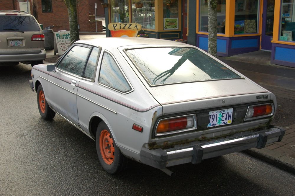 OLD PARKED CARS.: 1979 Datsun 210 Hatchback.