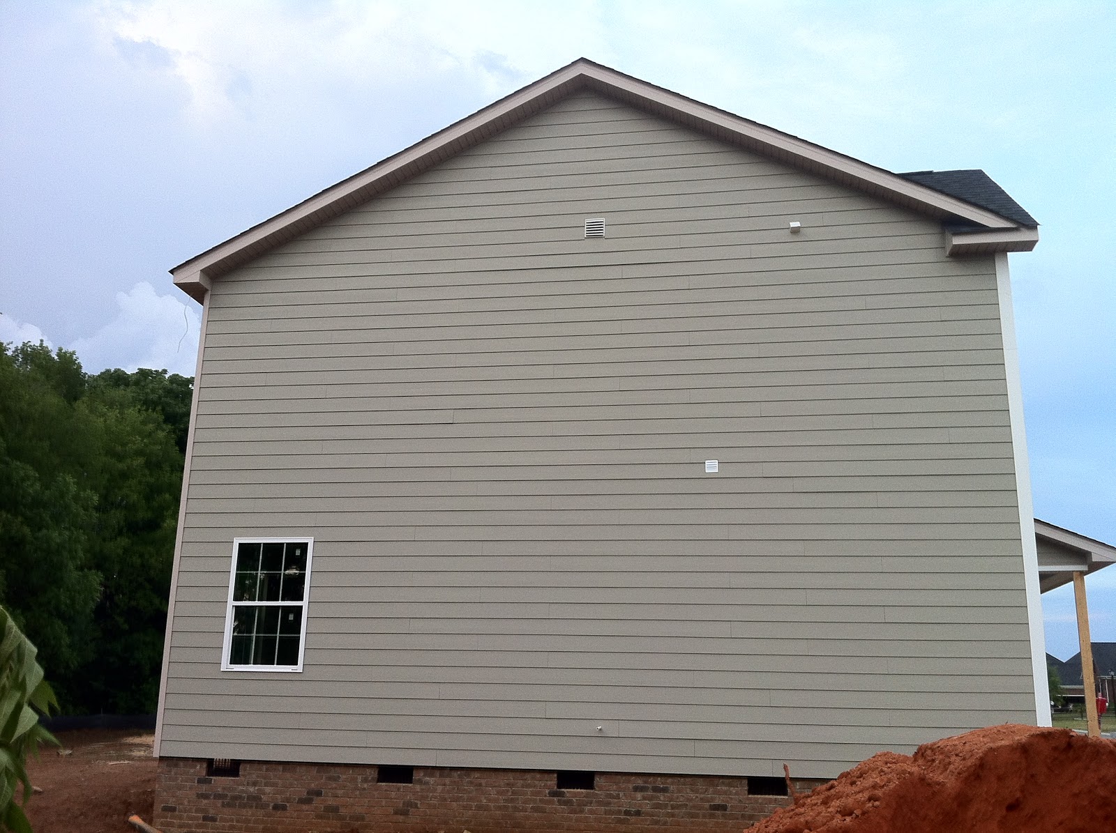 That's right, it's another Verona!: Garage door and siding complete.