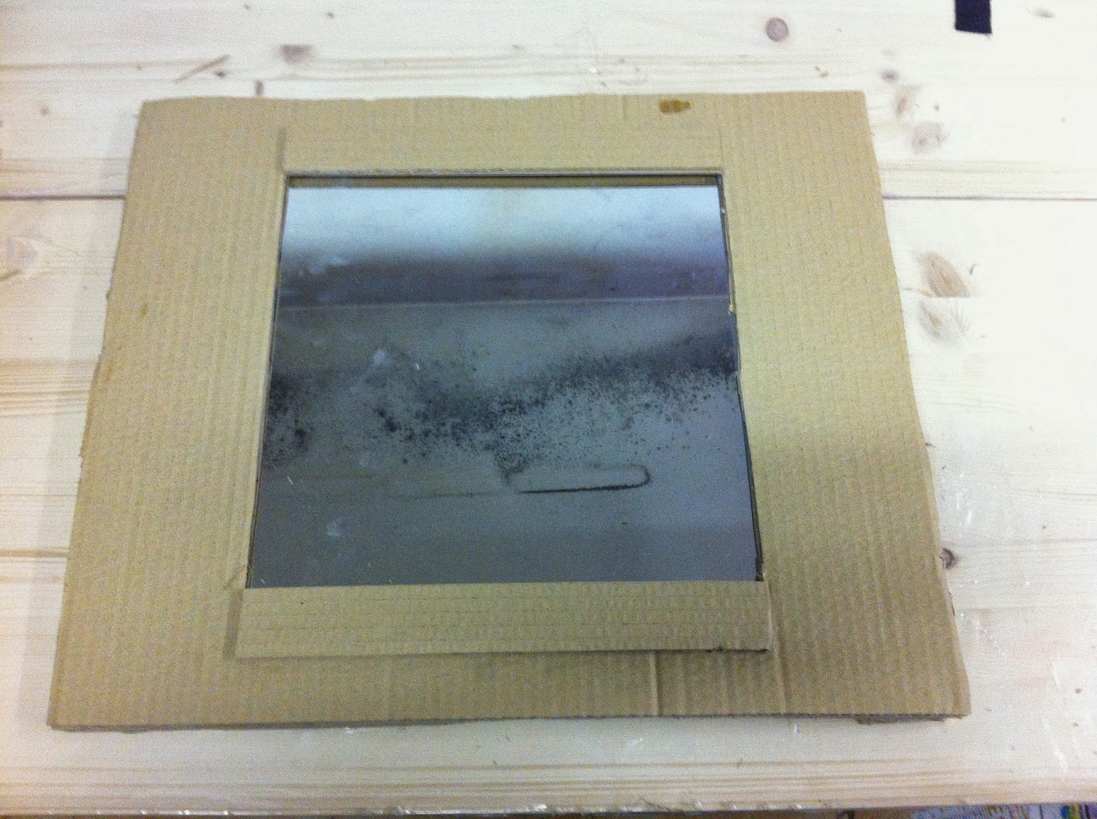 El Arte de Reciclar: Espejo con marco de cartón.