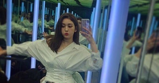 Jun Somi models around a room of mirrors