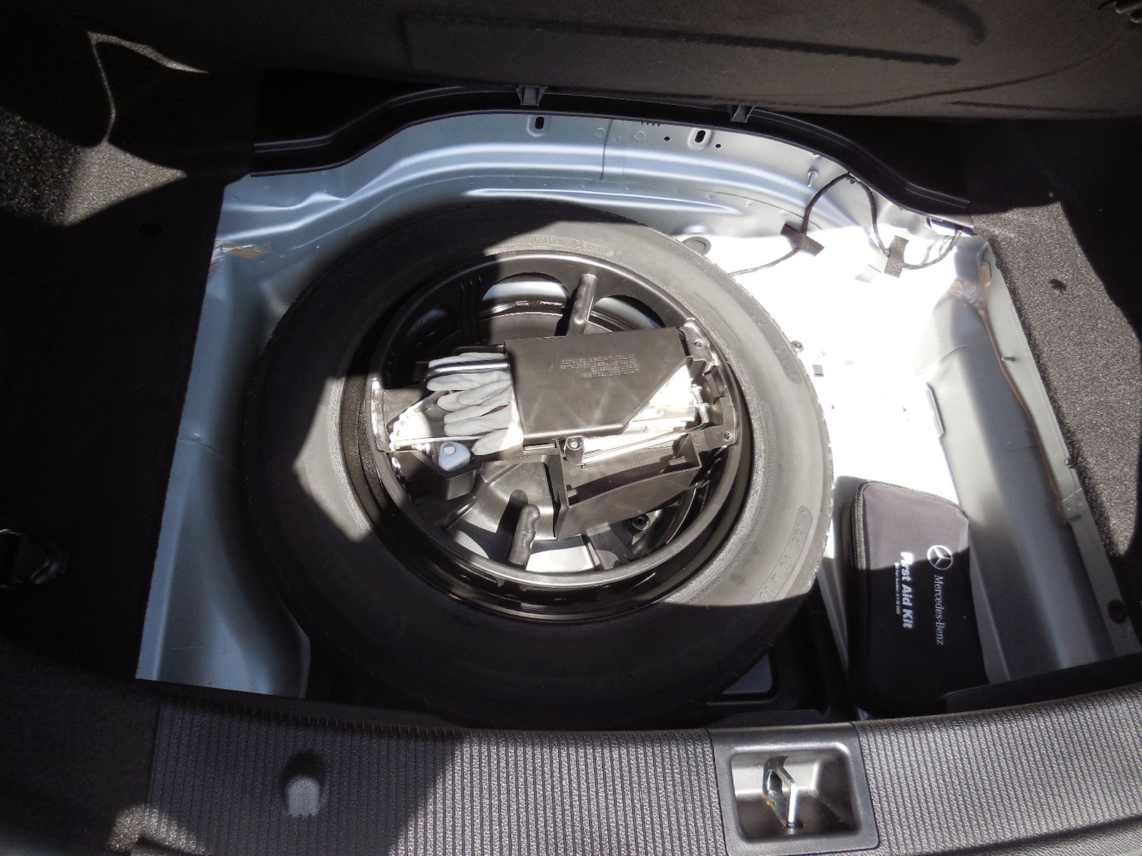 MERCEDES... SO DAMN CLASSY, THAT THE SPARE TIRE KIT INT HE TRUNK, HAS A ...