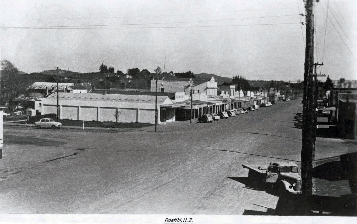 transpress nz: vehicles in Raetihi main street, 1950s