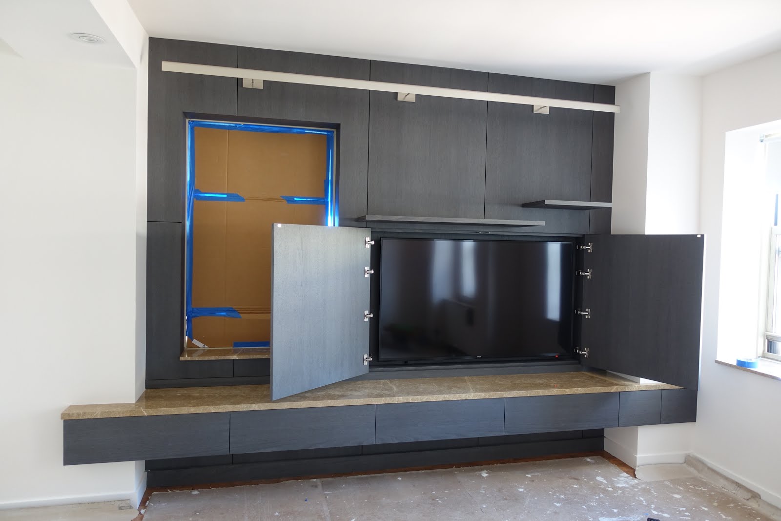 Anchorage Design : Grey Oak Veneer hidden Media Wall