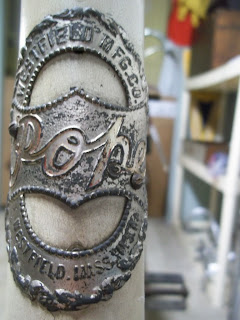 Fast is fast...: Antique bicycle badges.