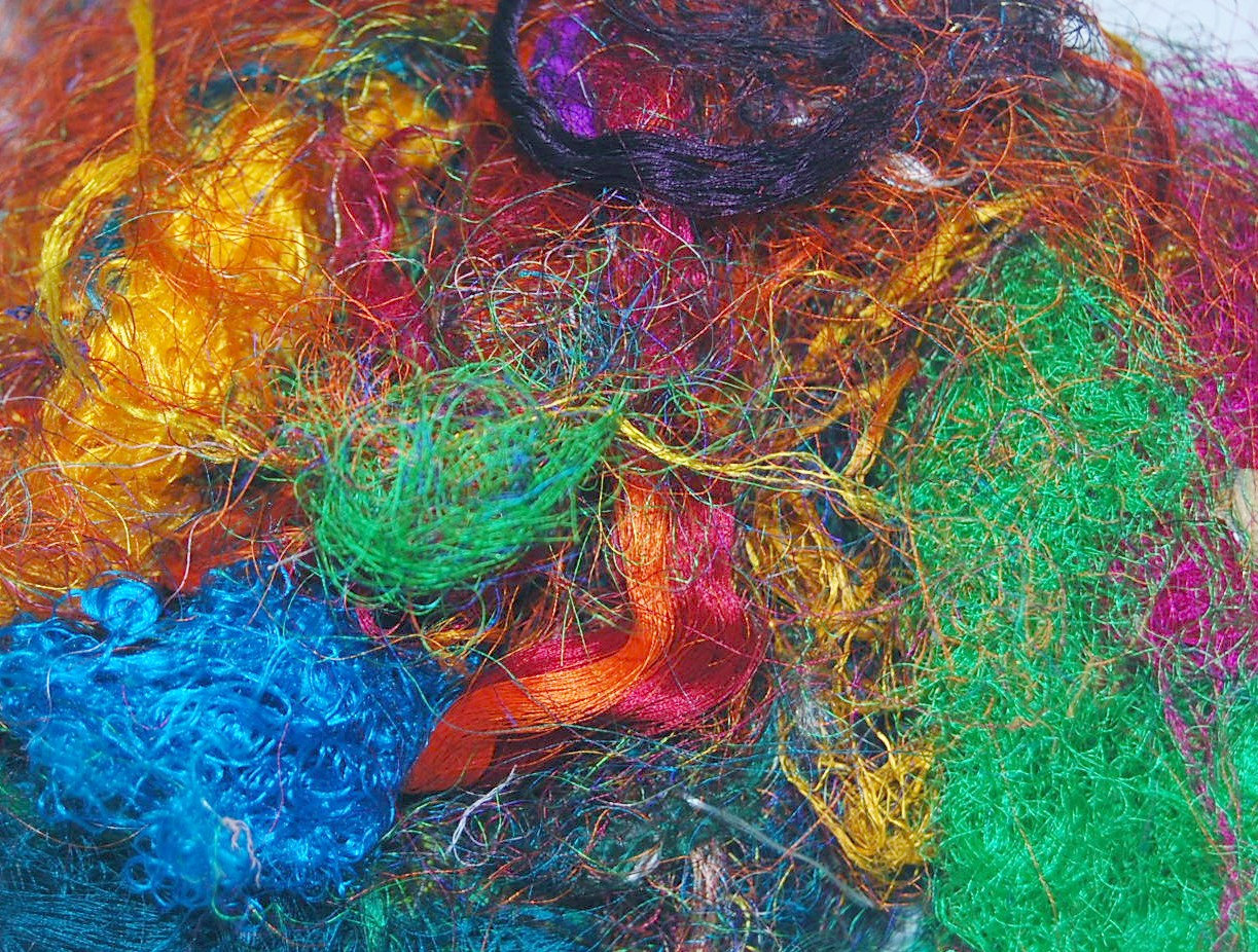 Spinning--a crazy carded batt with recycled sari silk | Milo Knows