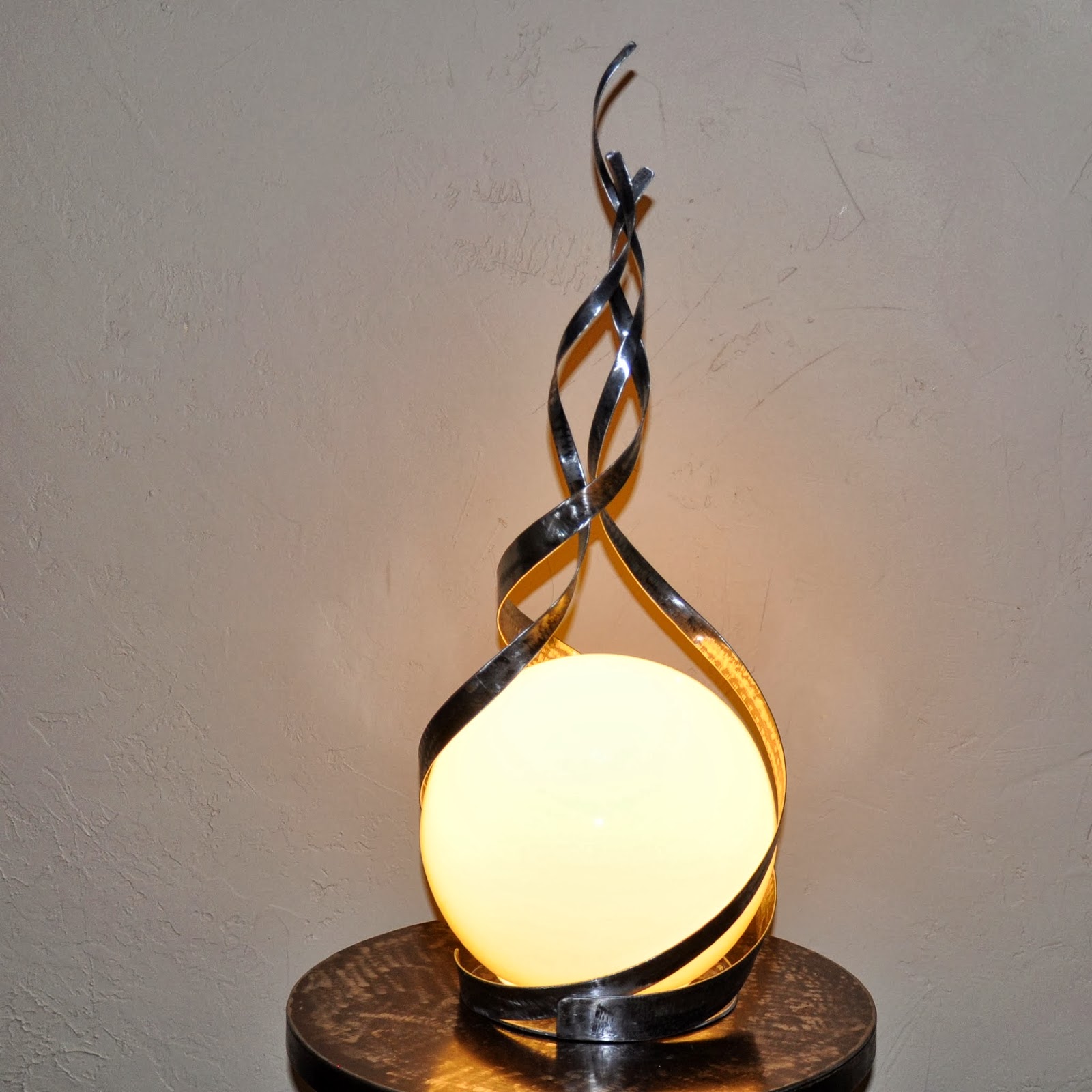créateur d'objets déco en fer forgé, bougeoirs, luminaires,porte bouteille